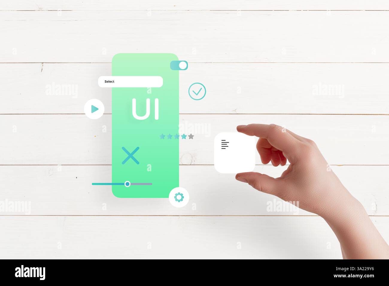 Top view of hand assembling app interface on table, placing text box ...