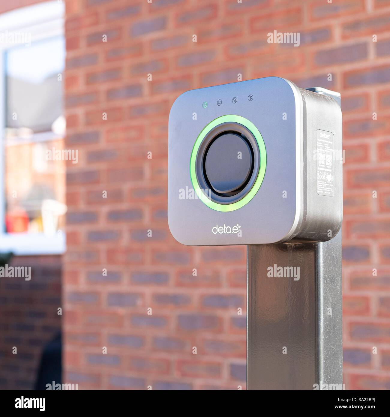 Close up of a Deta.e domestic charge point installed on outdoor post ...