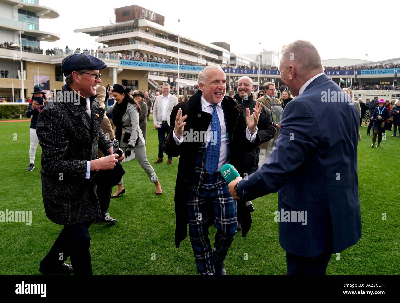 Winner owner Anthony Cooper-Barney (centre) celebrates after Jango Baie ...