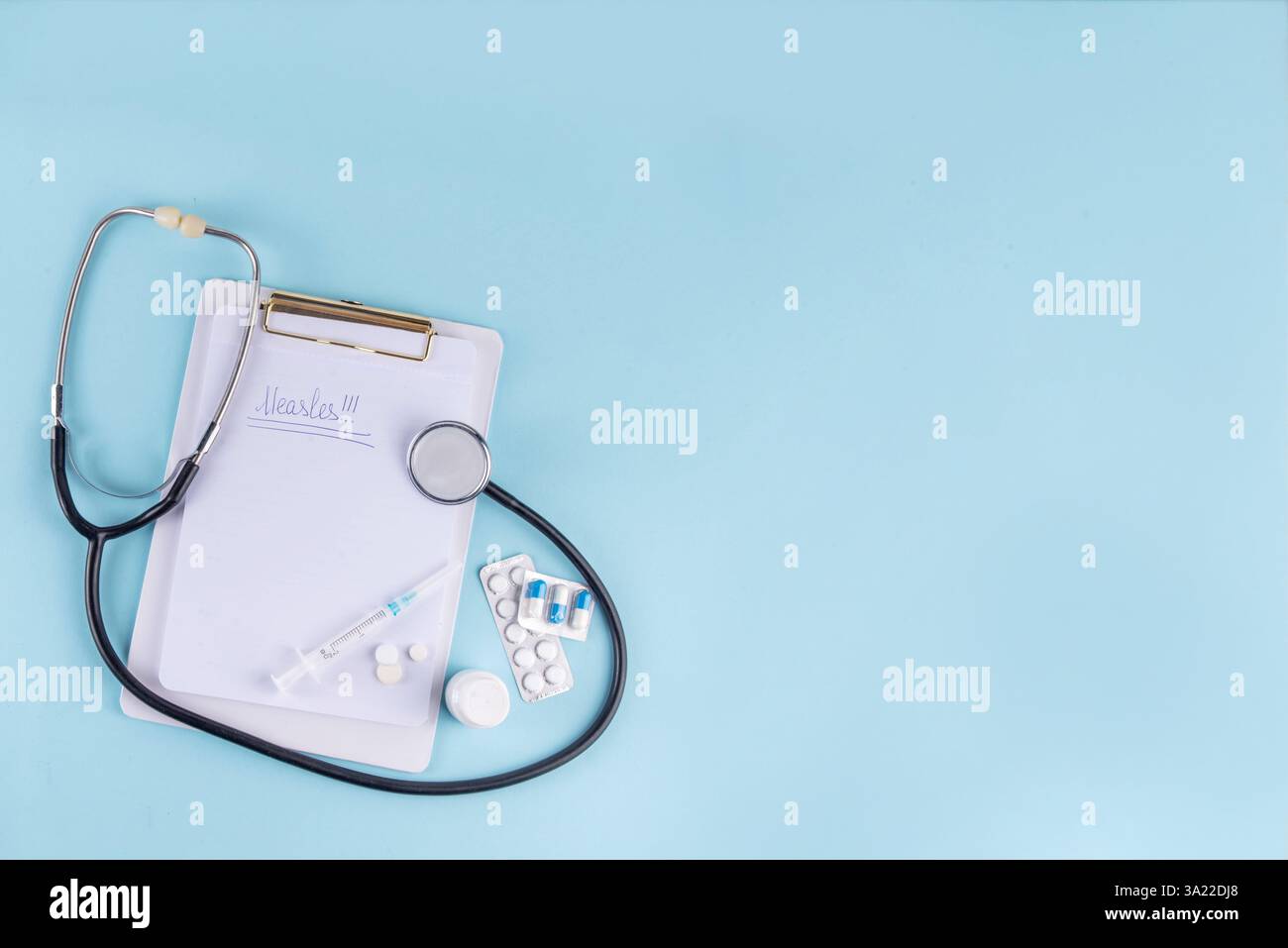 Hospital doctor notebook, with measles diagnosis, pills, vaccine or ...