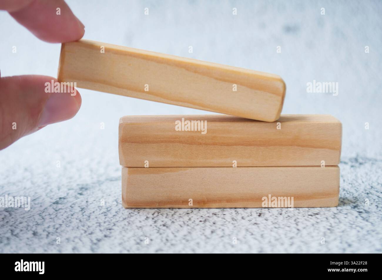 Hand holding wooden block with customizable space for text. Copy space ...