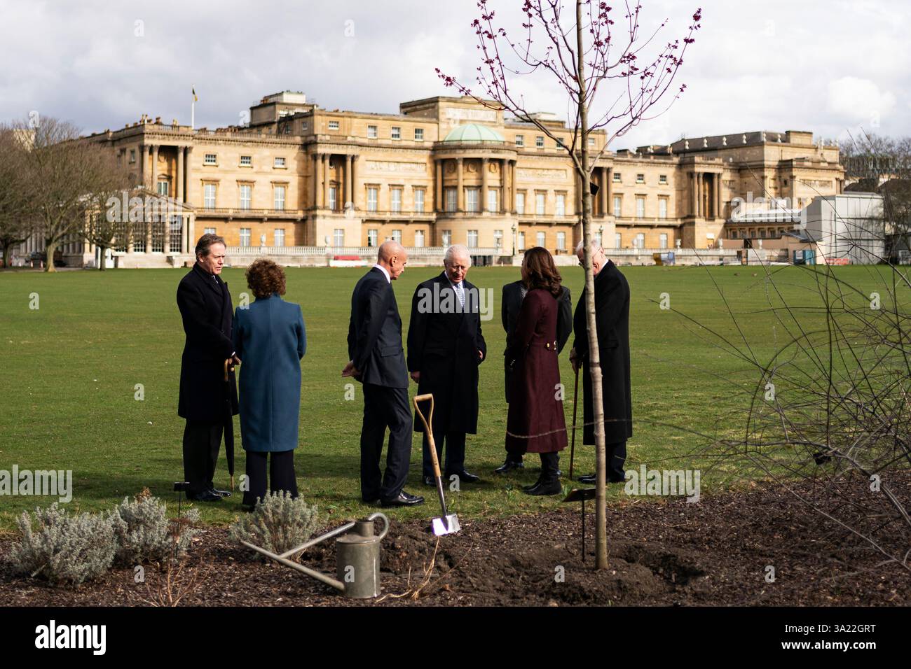 Britain's King Charles III, centre, stands with members of the Royal Commonwealth Society before ...