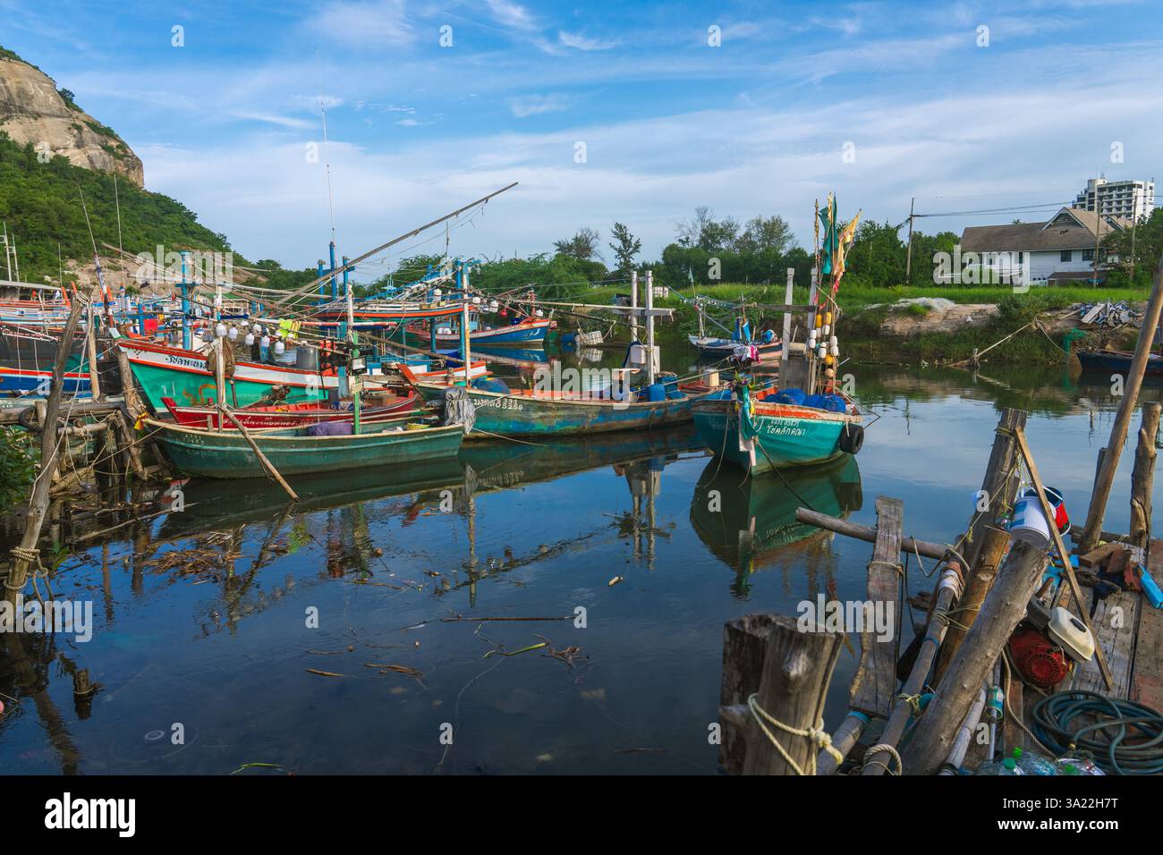 This is a view of traditional Thai fishing boats docked at the riverside in Takiap Thong Village ...