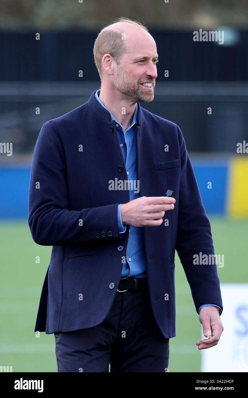 The Prince of Wales referees a mini football game during a visit to a ...