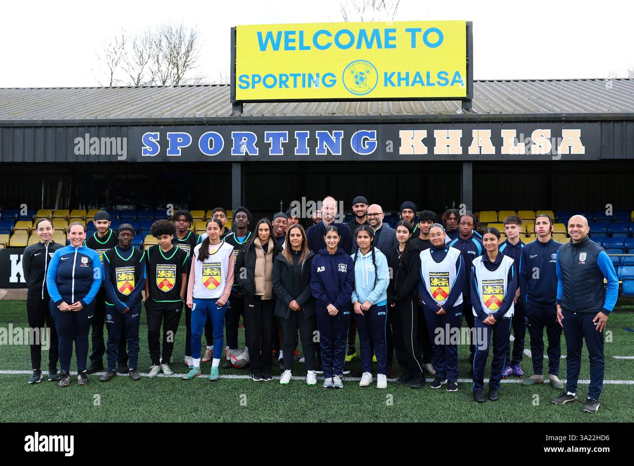 The Prince of Wales poses for a group photo with participants and staff ...