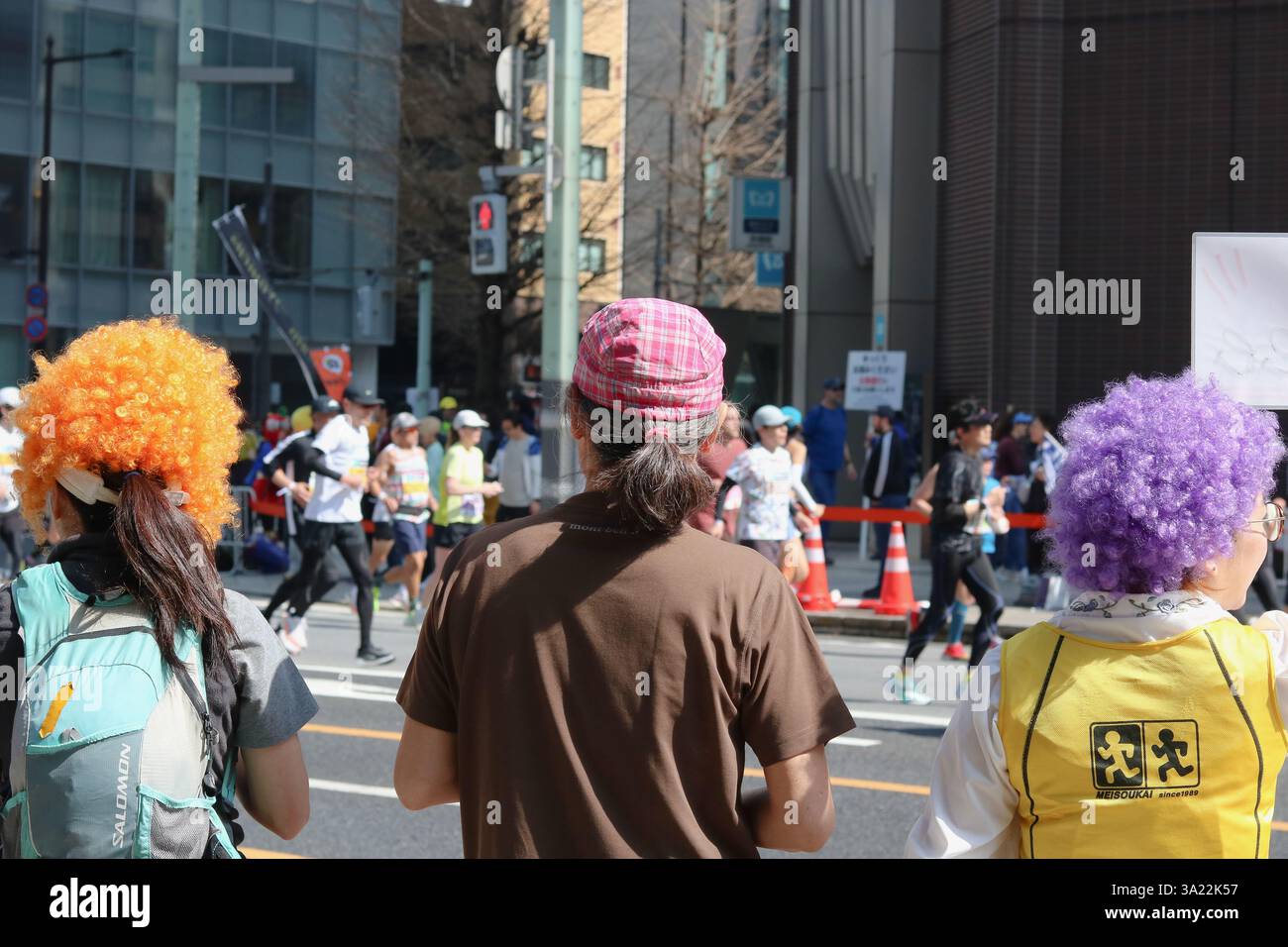 TOKYO, JAPAN - March 2, 2025: Supporters in colorful wigs cheering on ...
