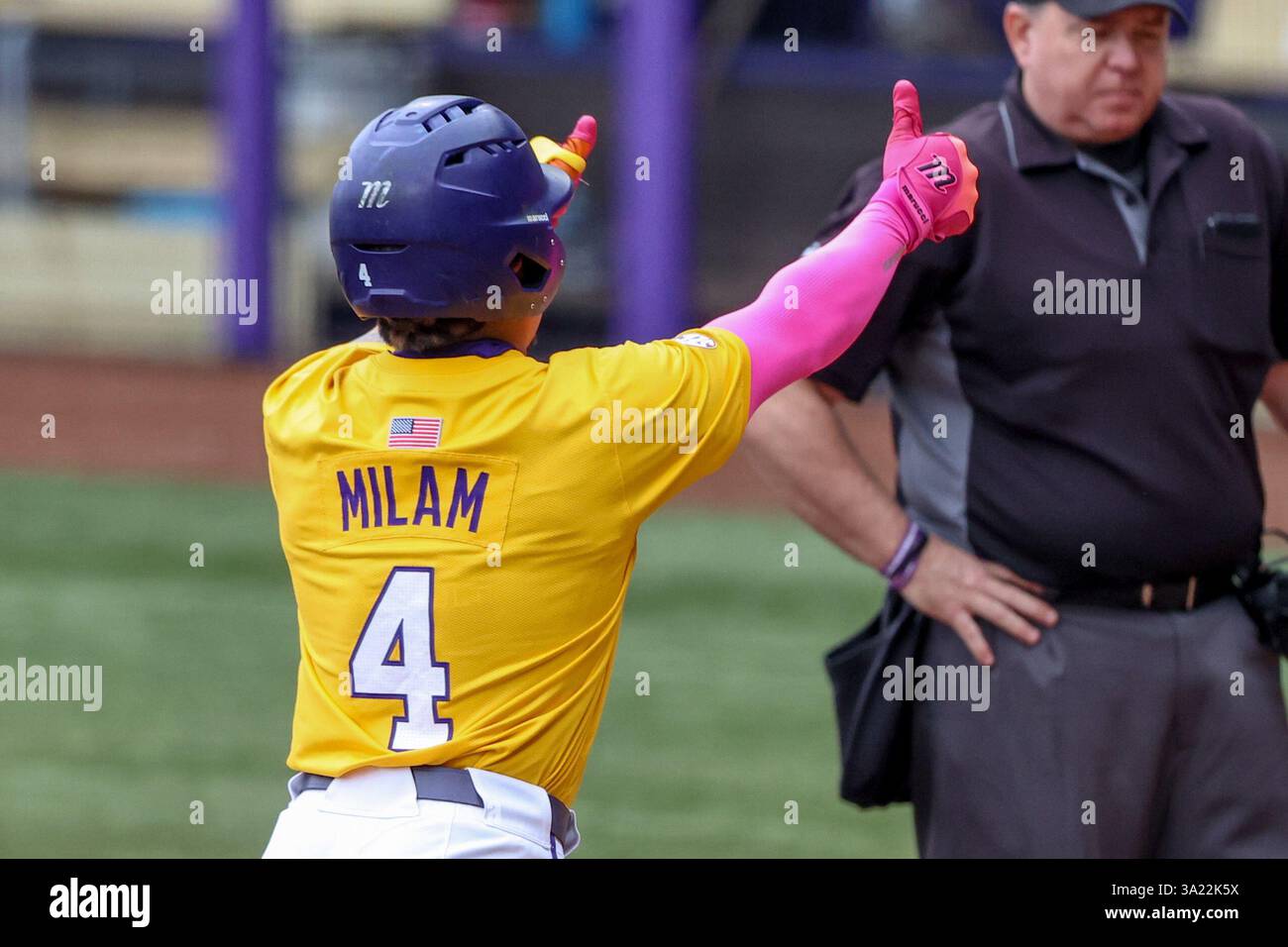 March 9, 2025: LSU's Steven Milam (4) signals to the dugout after ...