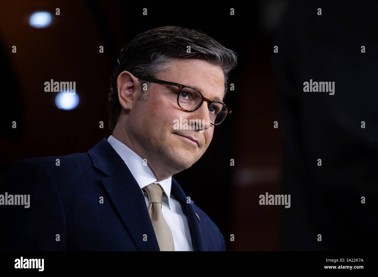 House Speaker Mike Johnson (R-La.) looks on during a press conference ...