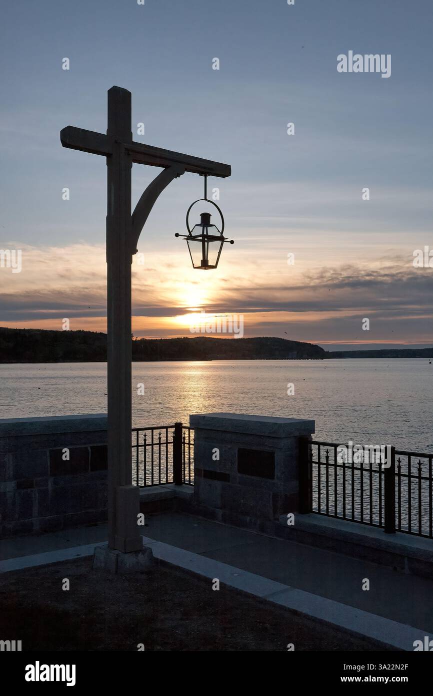 Sunset with lamp post and fencing Stock Photo - Alamy