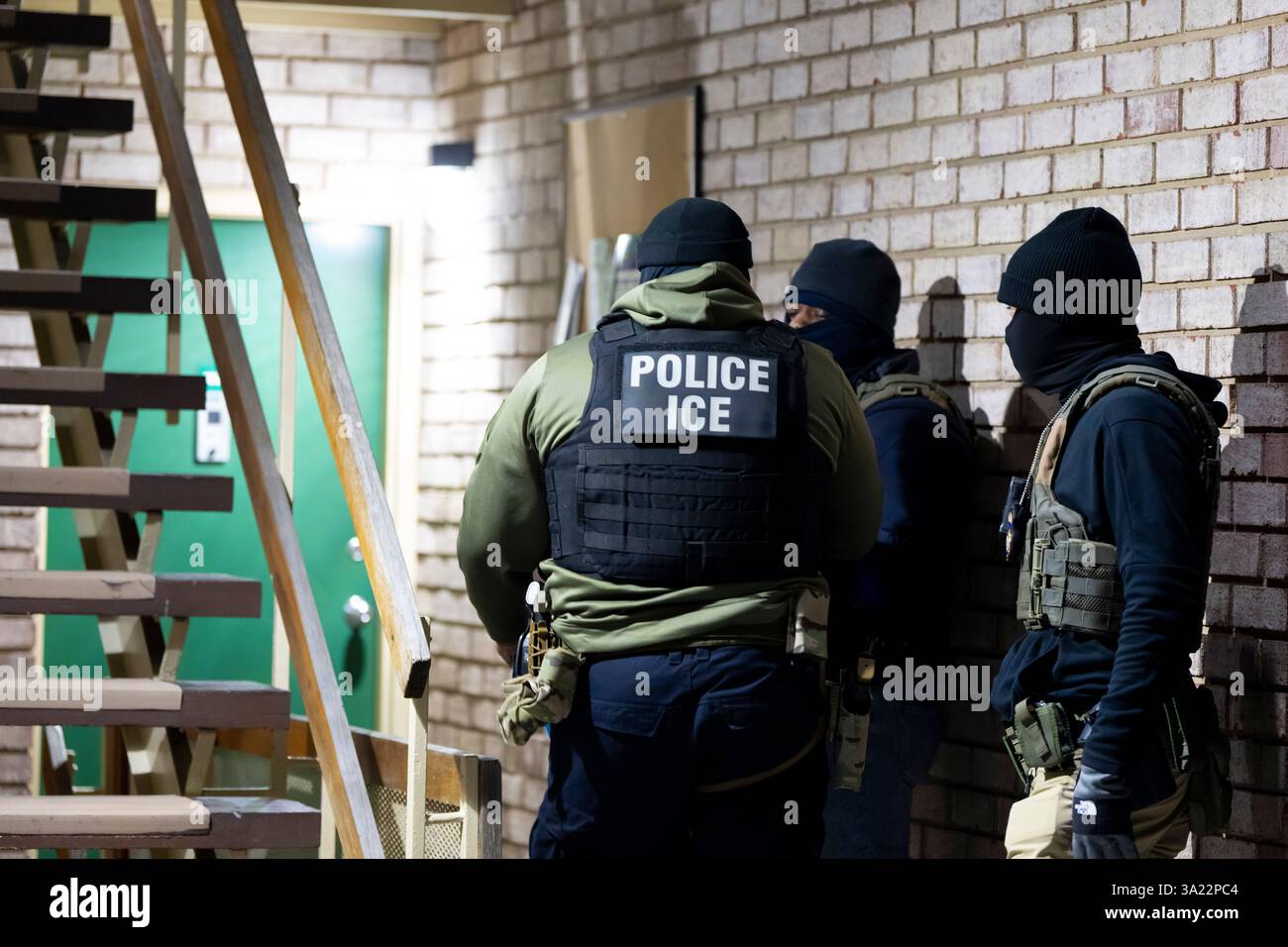 FILE - U.S. Immigration and Customs Enforcement officers wait to detain ...