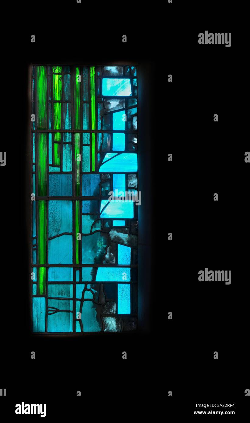 Stained glass window behind the baptismal font at the christian ...