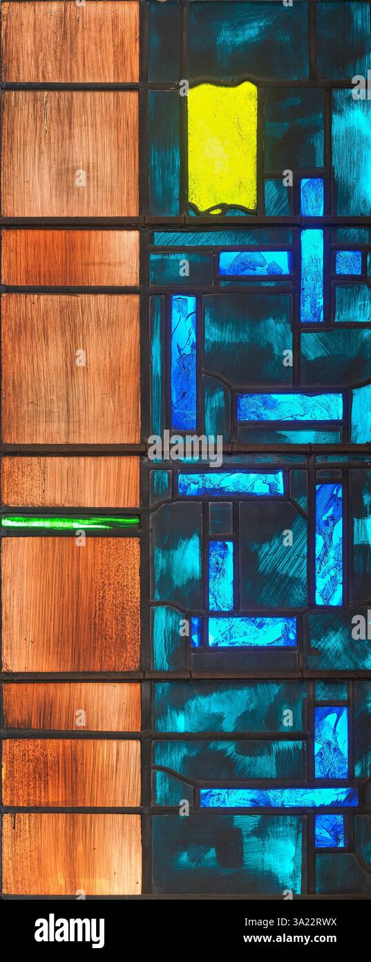 Stained glass window behind the baptismal font at the christian ...