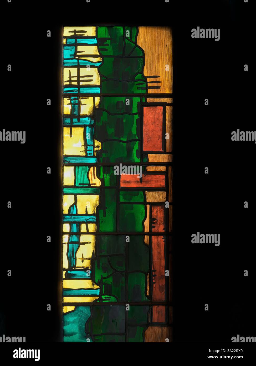 Stained glass window behind the baptismal font at the christian ...