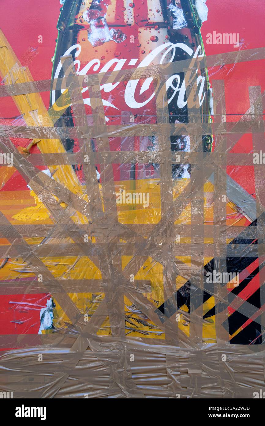 Coca Cola Advert Taped Up Stock Photo - Alamy