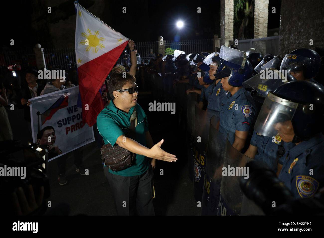 Supporters of former Philippine President Rodrigo Duterte stand in ...