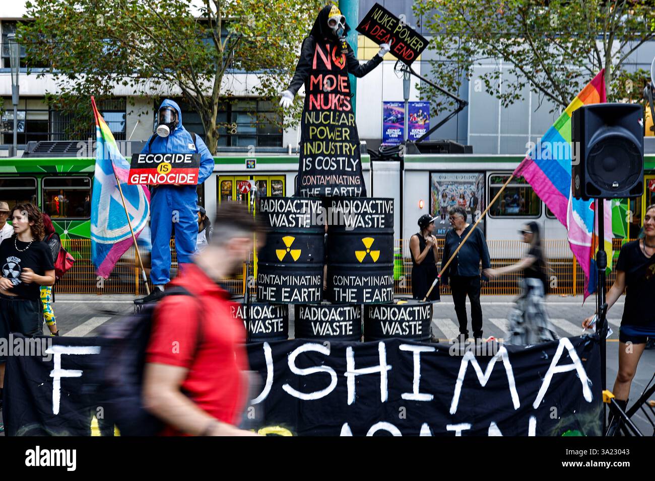 Protesters demonstrate in special costumes while holding placards ...