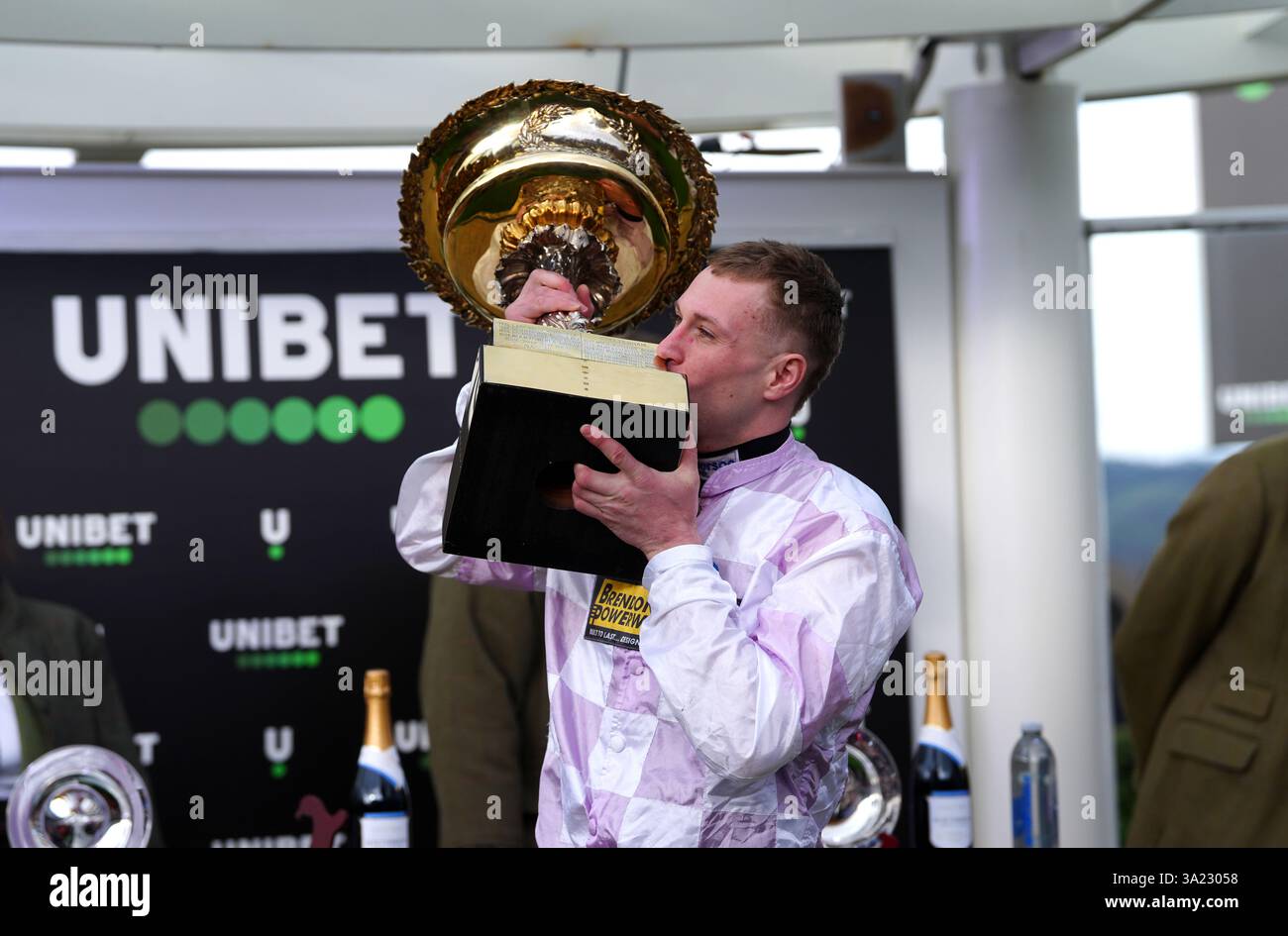 Jockey Lorcan Williams celebrates with the trophy after Golden Ace won ...