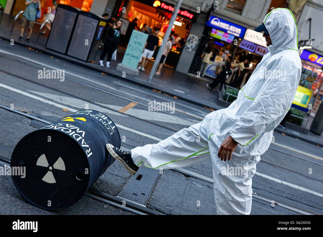 A protester rolls an empty oil tank during the rally. March 11 2025 ...