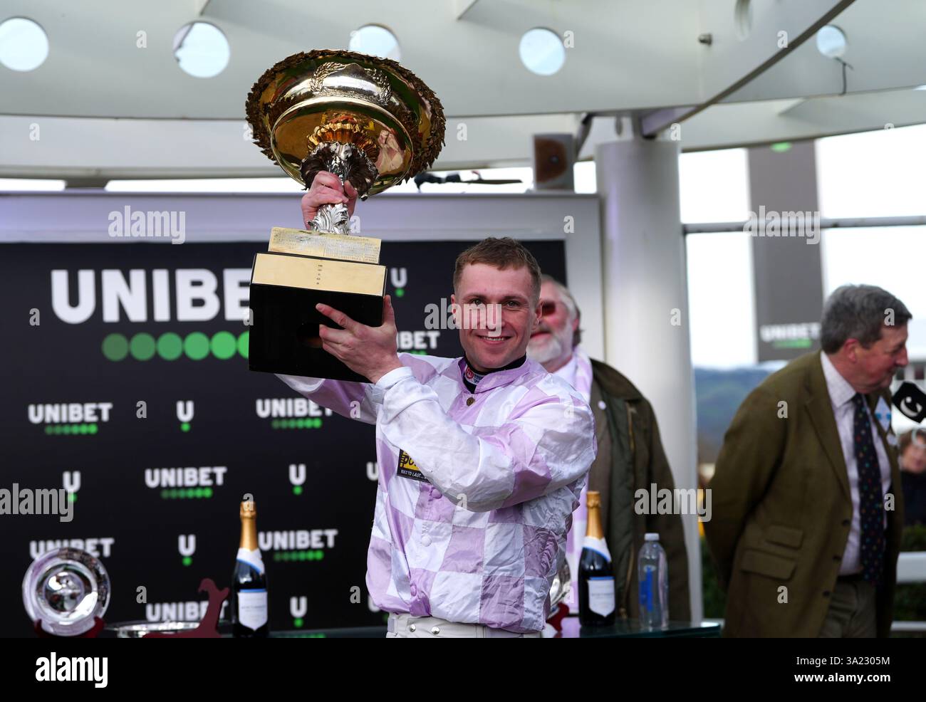 Jockey Lorcan Williams celebrates with the trophy after Golden Ace won ...