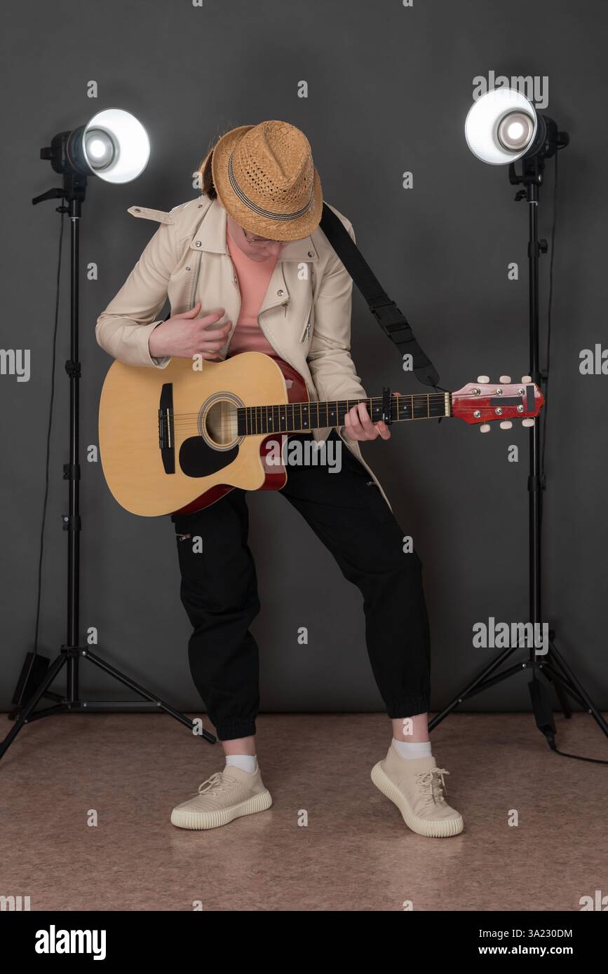 Expression woman guitarist plucking Spanish six string acoustic guitar ...