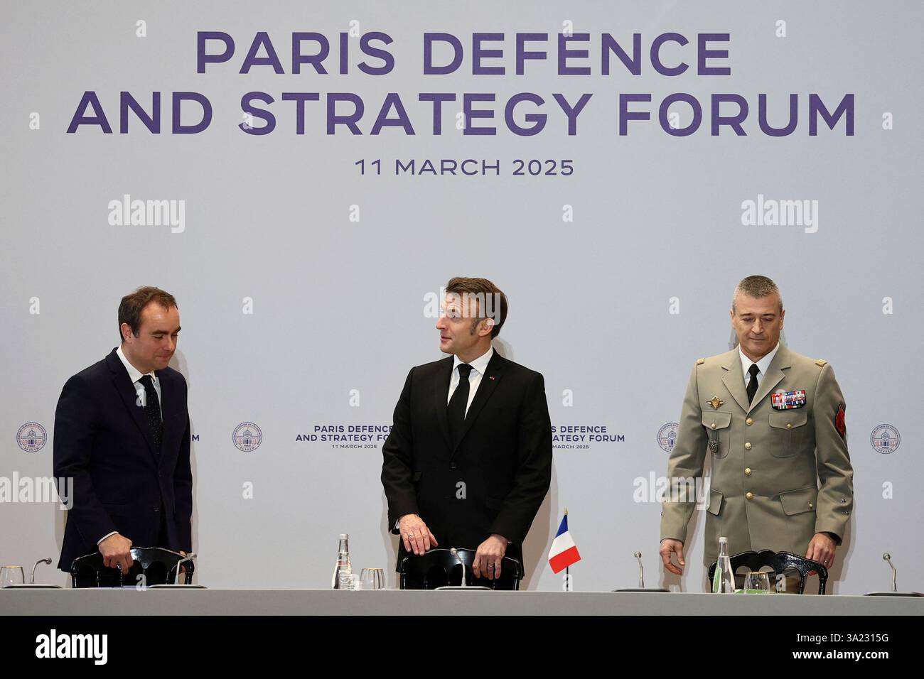 French President Emmanuel Macron, center, French Defense Minister ...