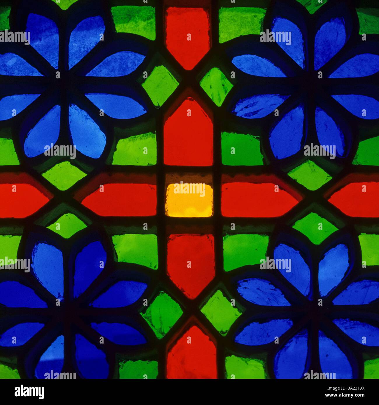 Close detail of geometric Yemeni stained glass in red, green, blue ...