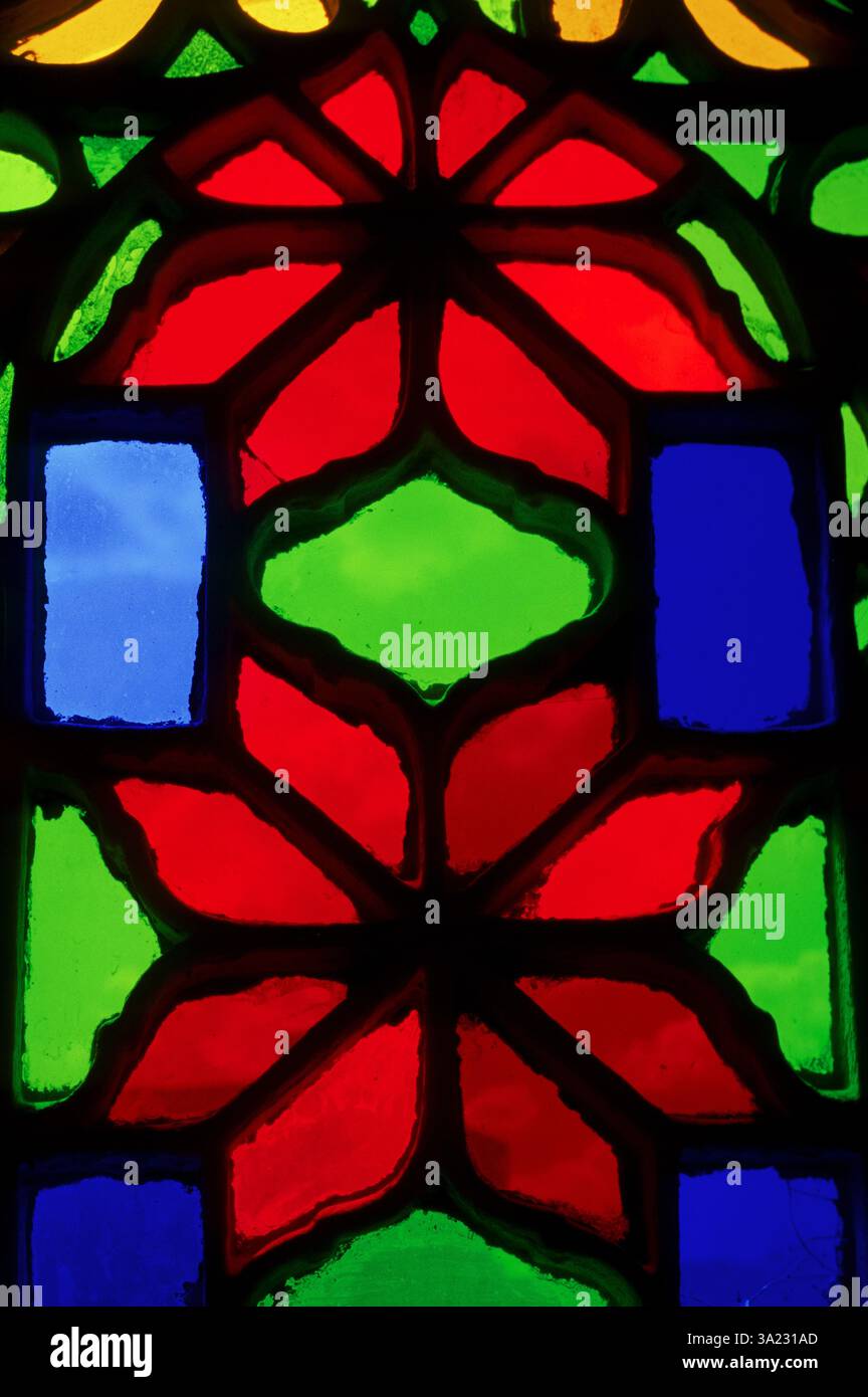 Radiant red and blocks of blue, with patches of green and orange ...