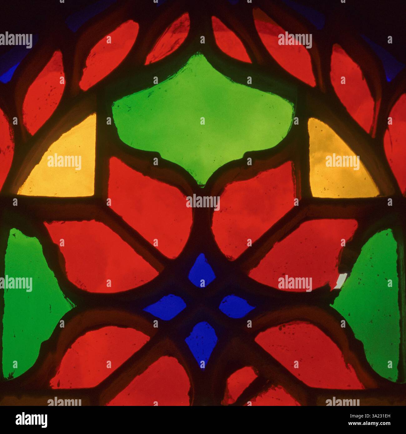 Red pieces of tulip-shaped stained glass fill the centre of a ...