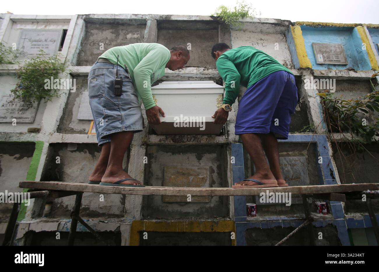 FILE - Cemetery workers carry the coffin of alleged drug user Marcelo ...