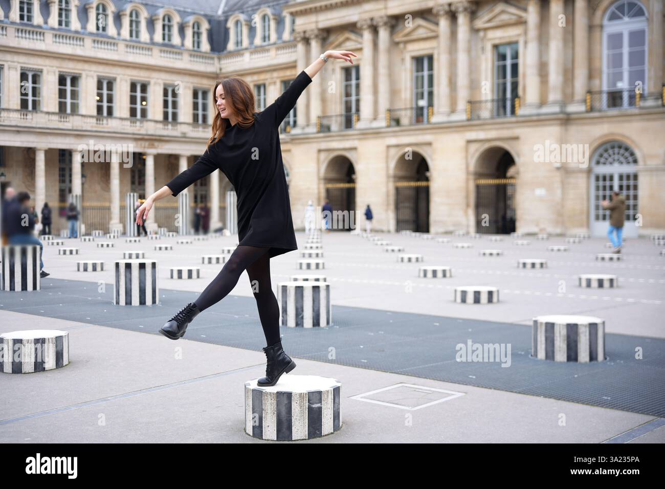 An Elegant Pose on Beautiful Artful Pillars Set Against the Stunning ...