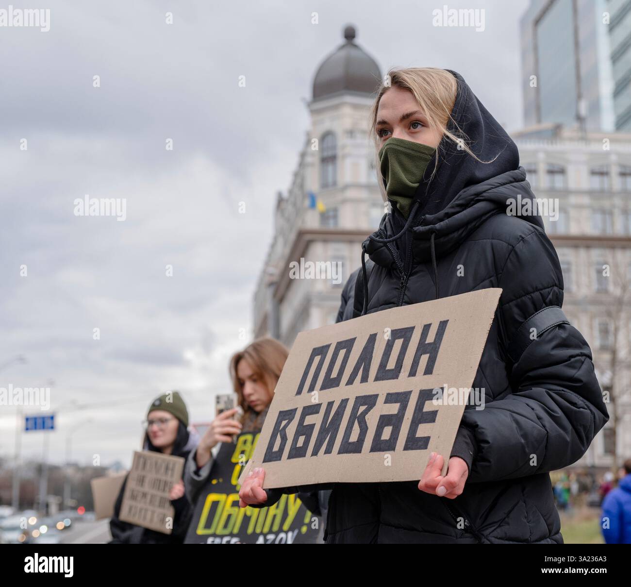Kyiv, Ukraine - 2d, February, 2025: Woman holding banner "Captivity ...