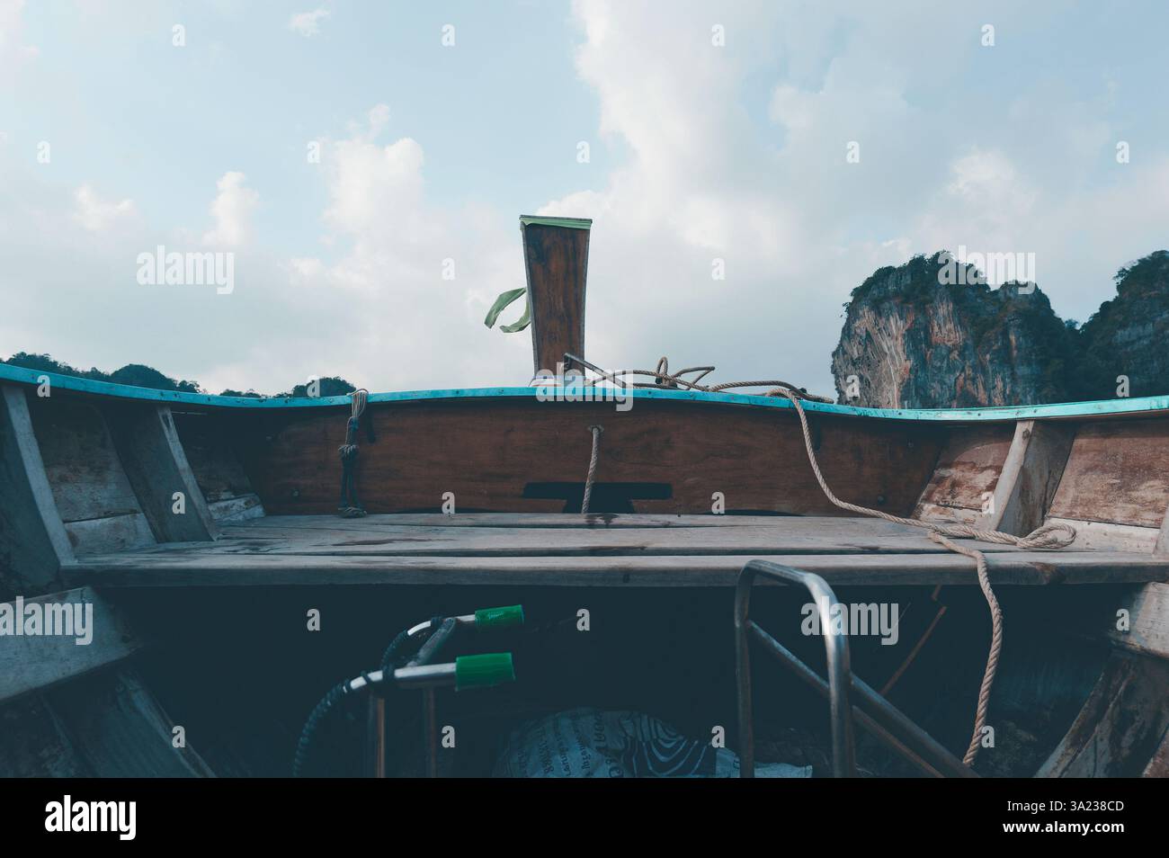 The interior of a traditional wooden longtail boat, showing its rustic ...
