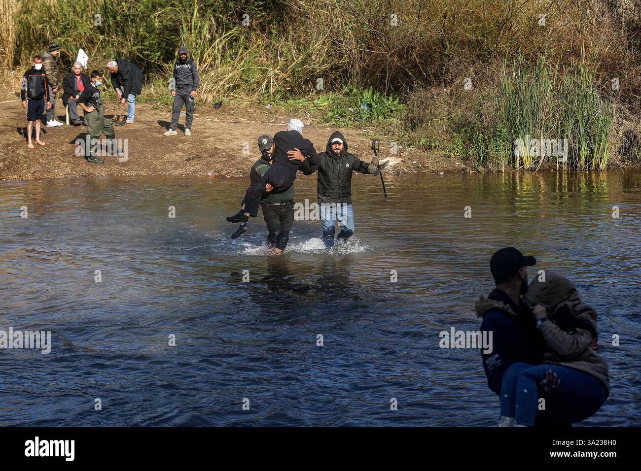 Hekr El Dahri, Lebanon. 11th Mar, 2025. Syrian Alawite refugees cross ...