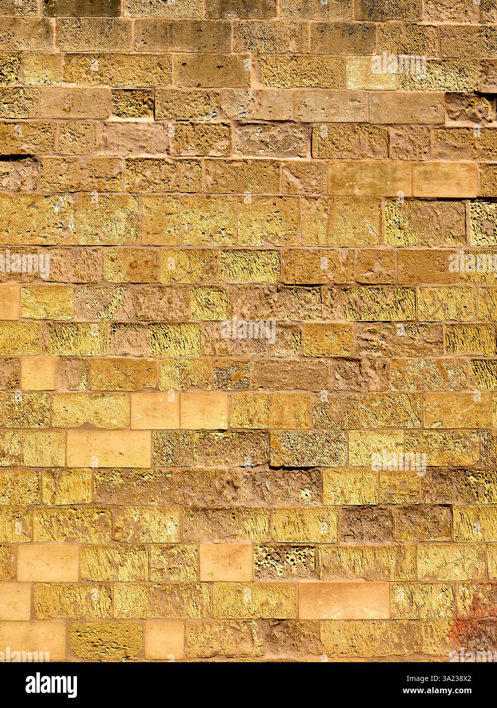 Background texture of a sandstone brick wall Stock Photo - Alamy
