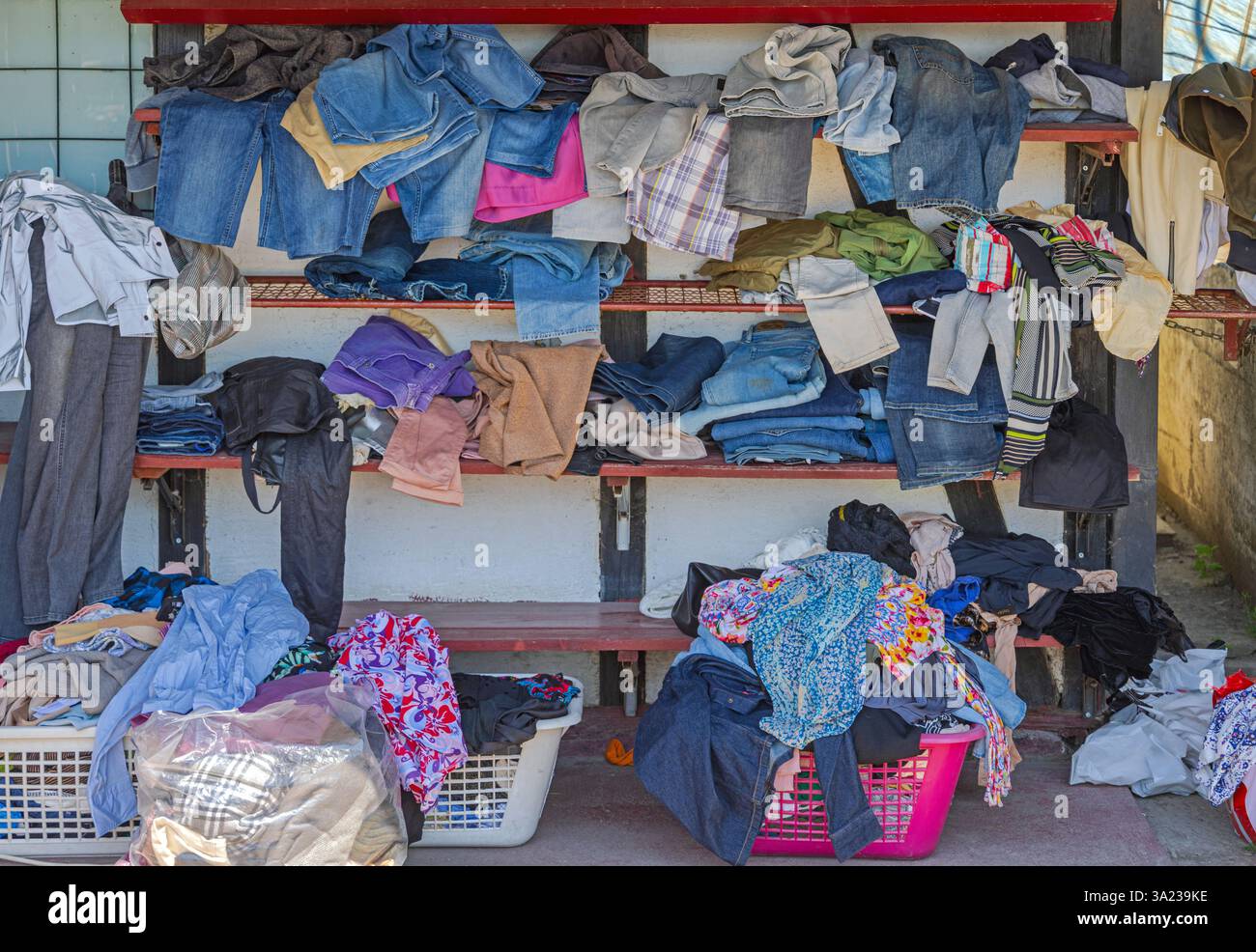 Messy Chaos Wardrobe Closet Shelf With Pants Denim and Baskets With ...