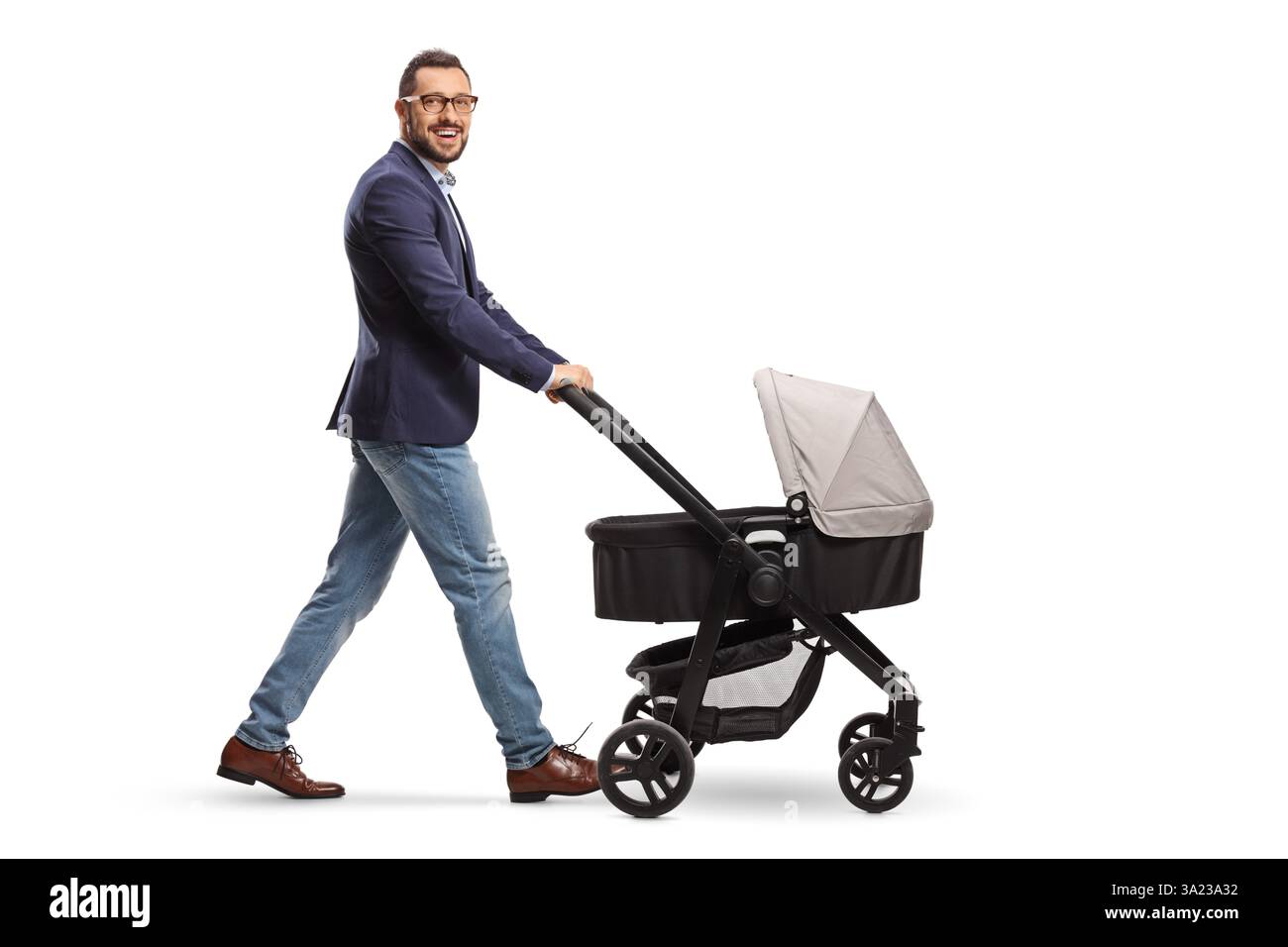 Full length shot of a man pushing a baby stroller isolated on white ...