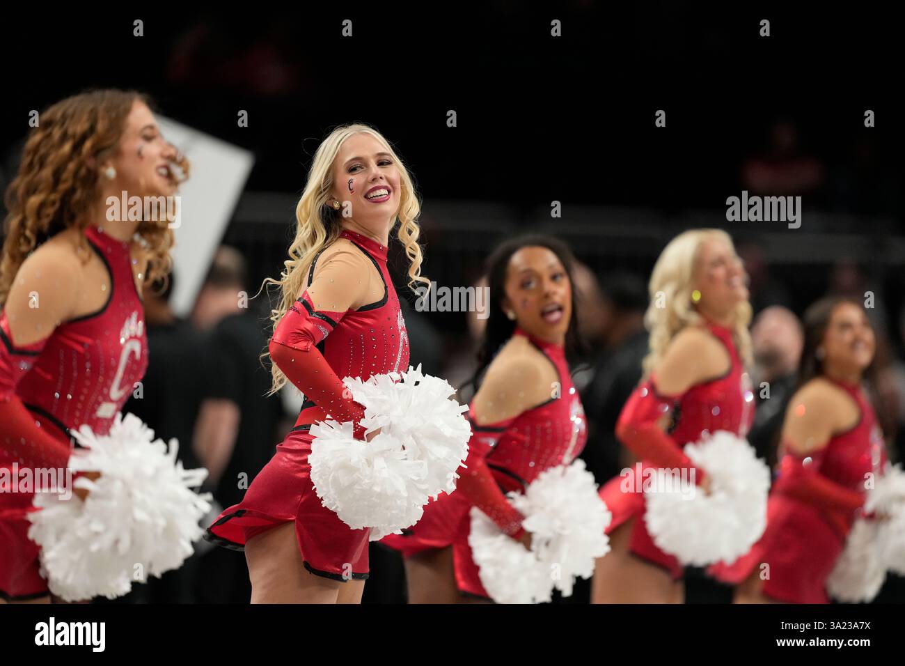 Cheerleaders perform during the second half of an NCAA college ...