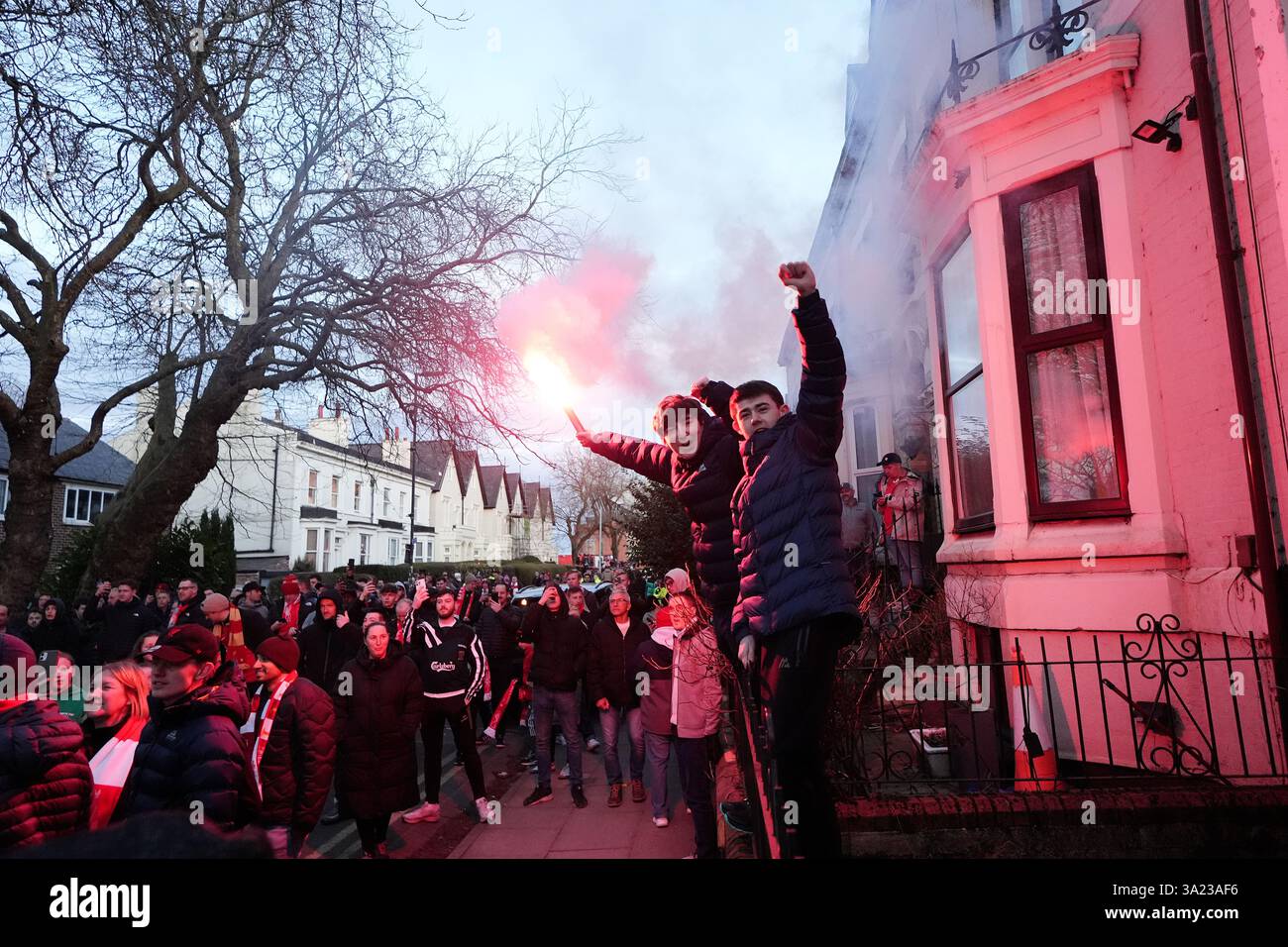 Liverpool fans let off flares outside the ground as they wait for the ...