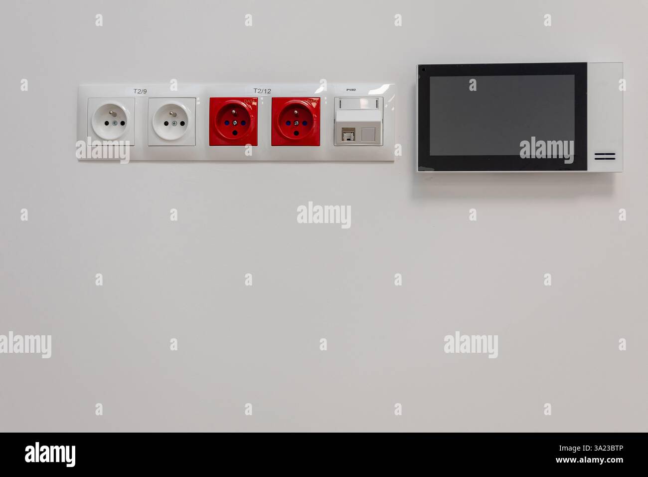 A meticulous clean installation of electrical outlets and a control ...