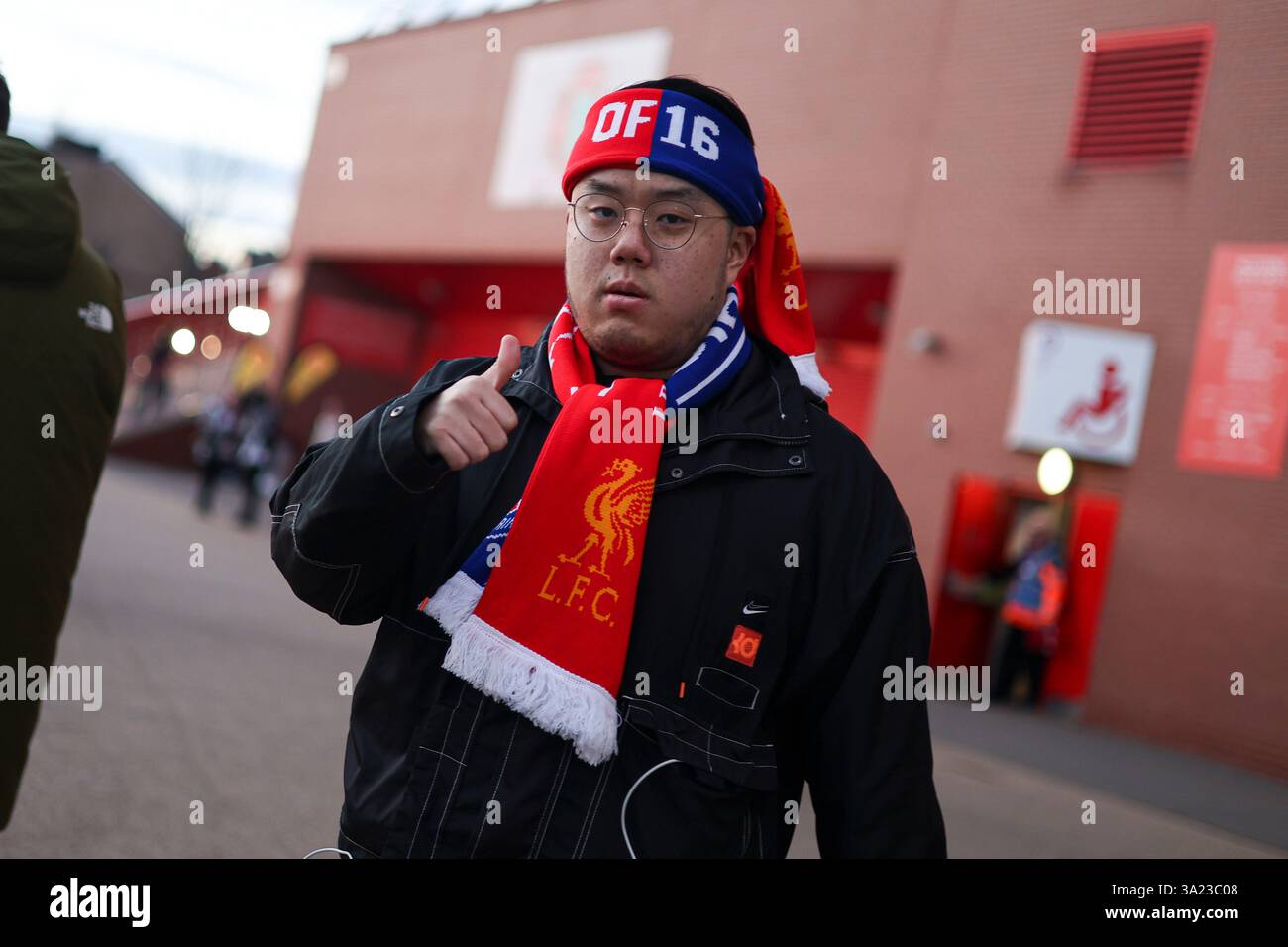A Liverpool supporter arrives during the Liverpool FC v Paris Saint ...