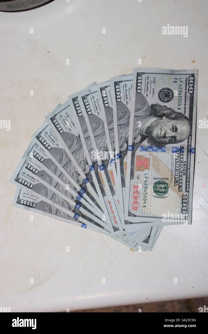 Many American $100-dollar bills spread ou Stock Photo - Alamy