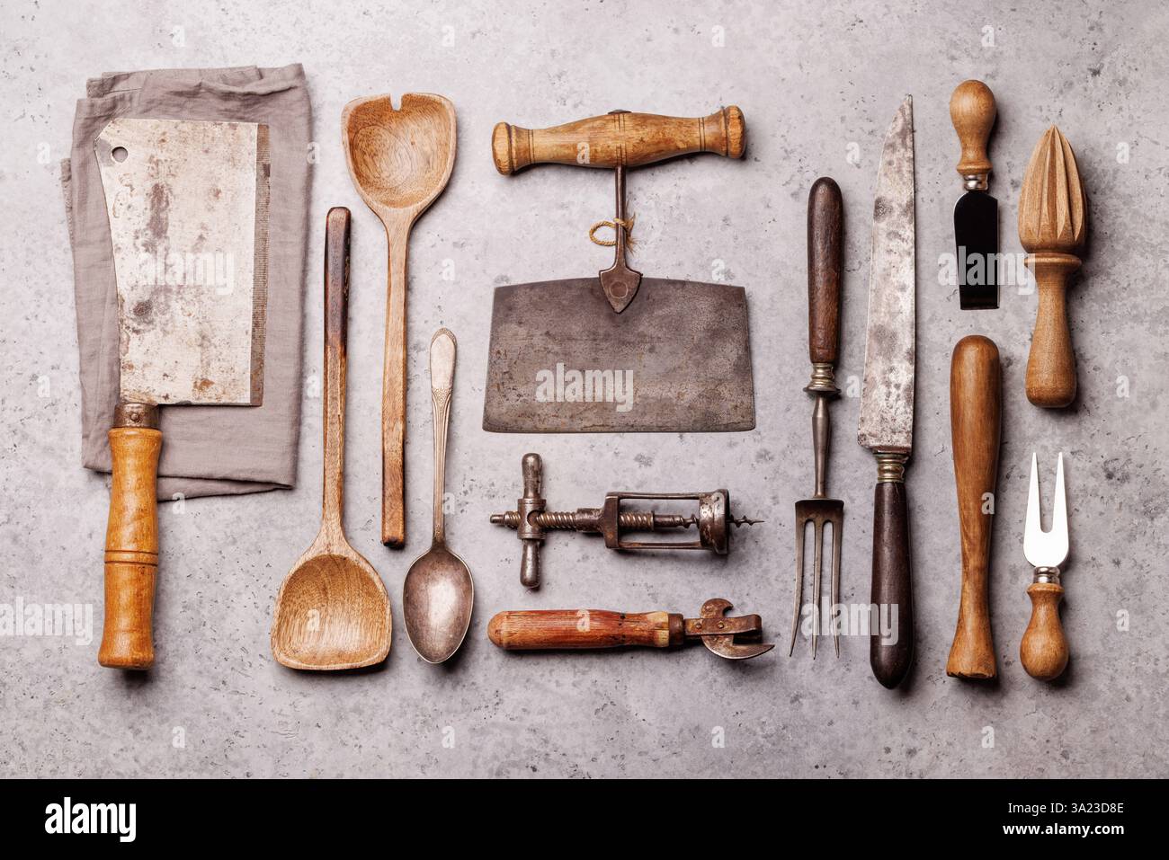 A collection of various retro kitchen and cooking utensils displayed on ...