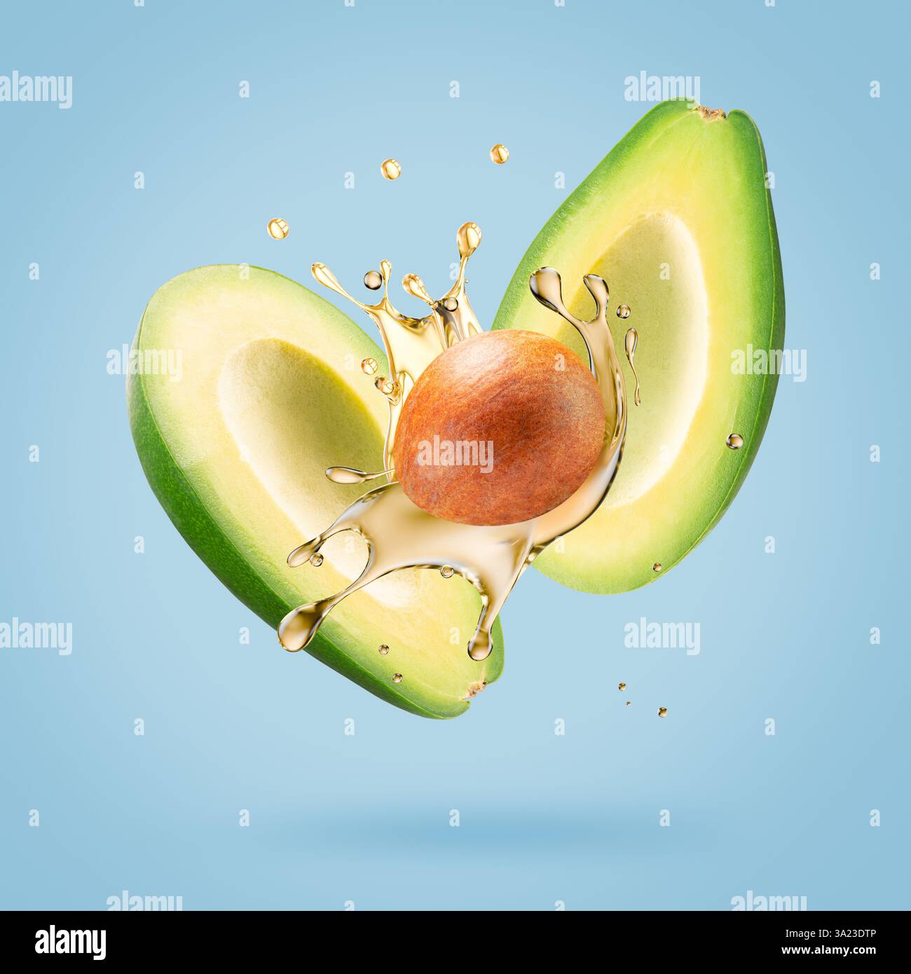 avocado with oil splash on a light blue background Stock Photo - Alamy