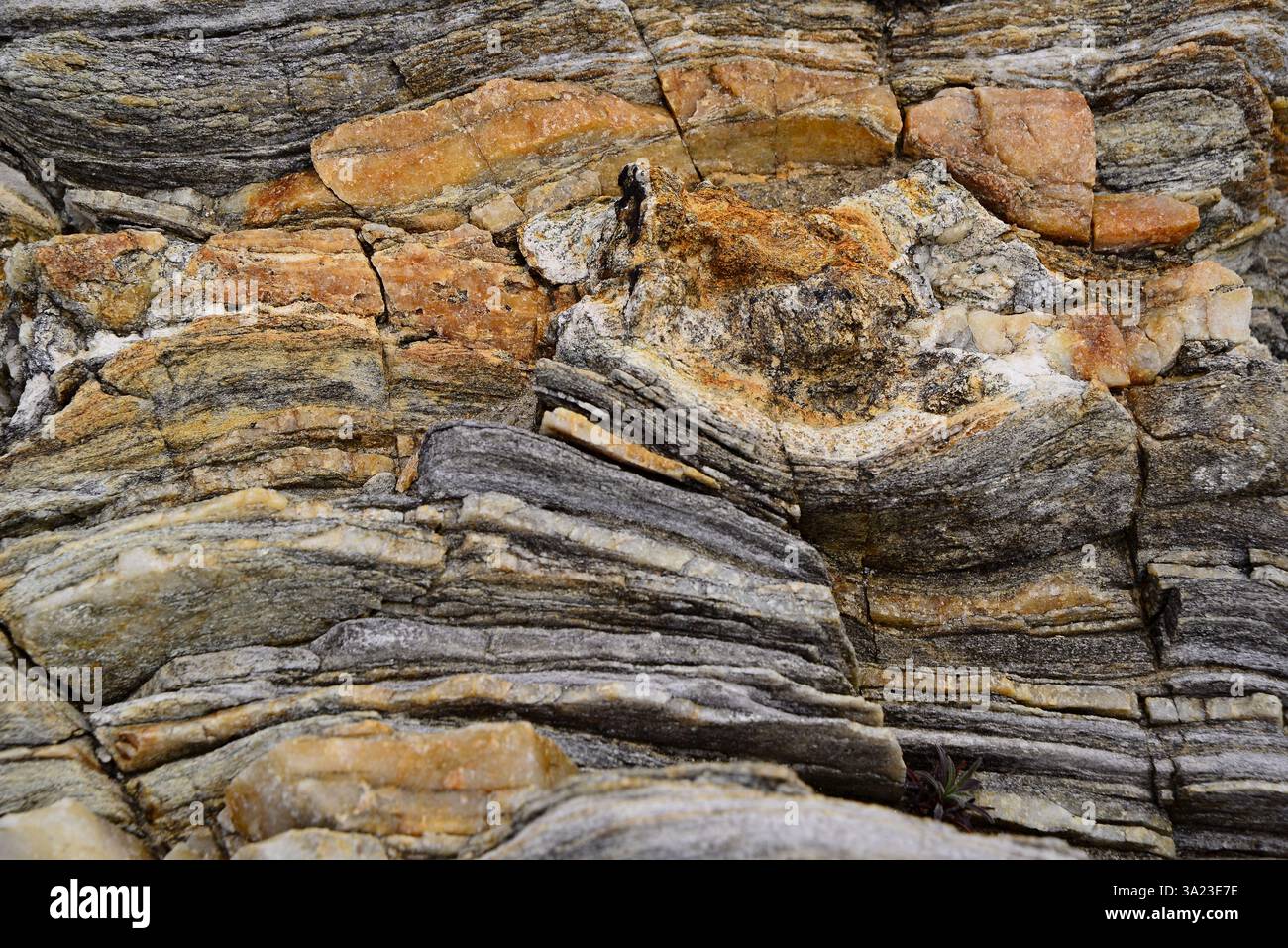 Stratified rocks with traces of volcanic activity Stock Photo - Alamy