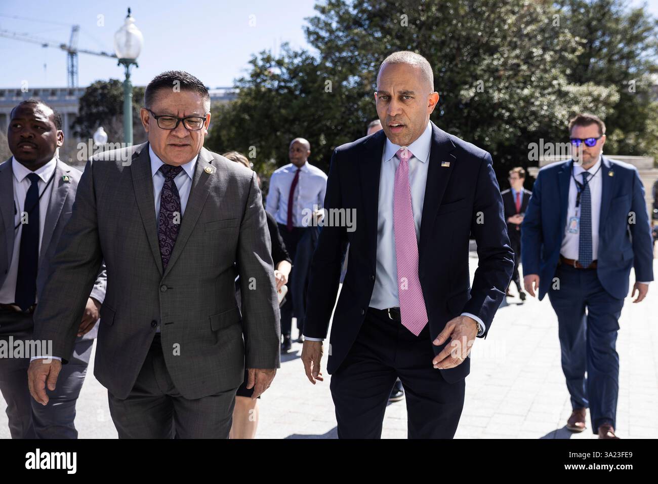 House Minority Leader Hakeem Jeffries (D-N.Y.), at center right, walks ...