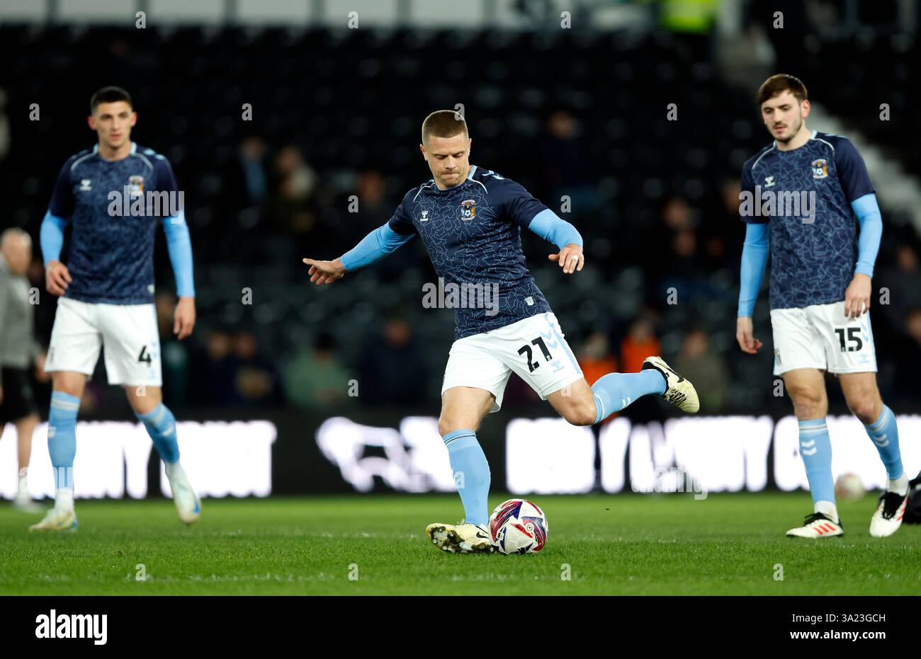 Coventry City's Jake Bidwell (centre) warming up ahead of the Sky Bet ...