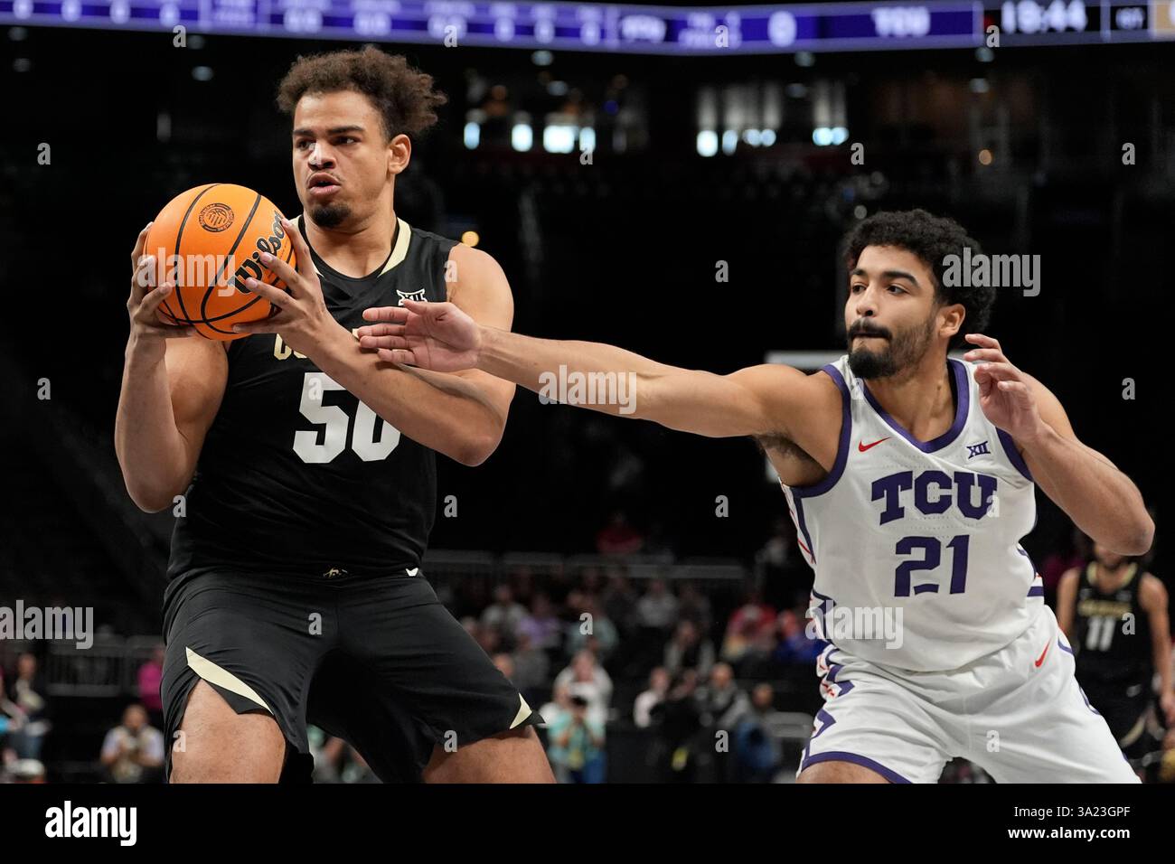 Colorado's Elijah Malone, left, controls the ball as TCU's Noah Reynolds (21) defends during the ...
