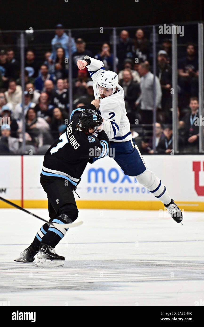 Toronto Maple Leafs defenseman Simon Benoit (2) jumps to punch Utah ...