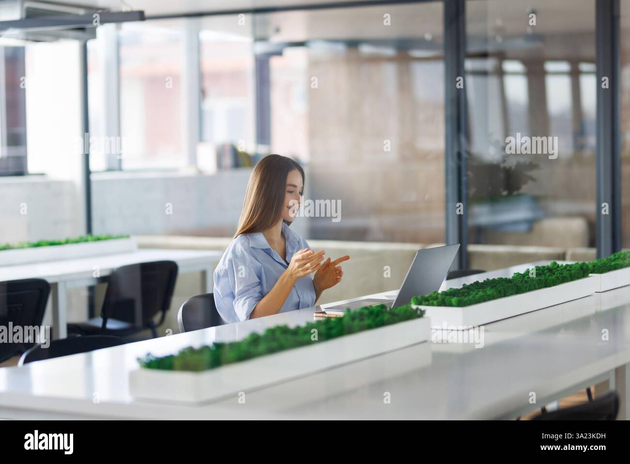 Cheerful business lady working on laptop in office. happy beautiful ...