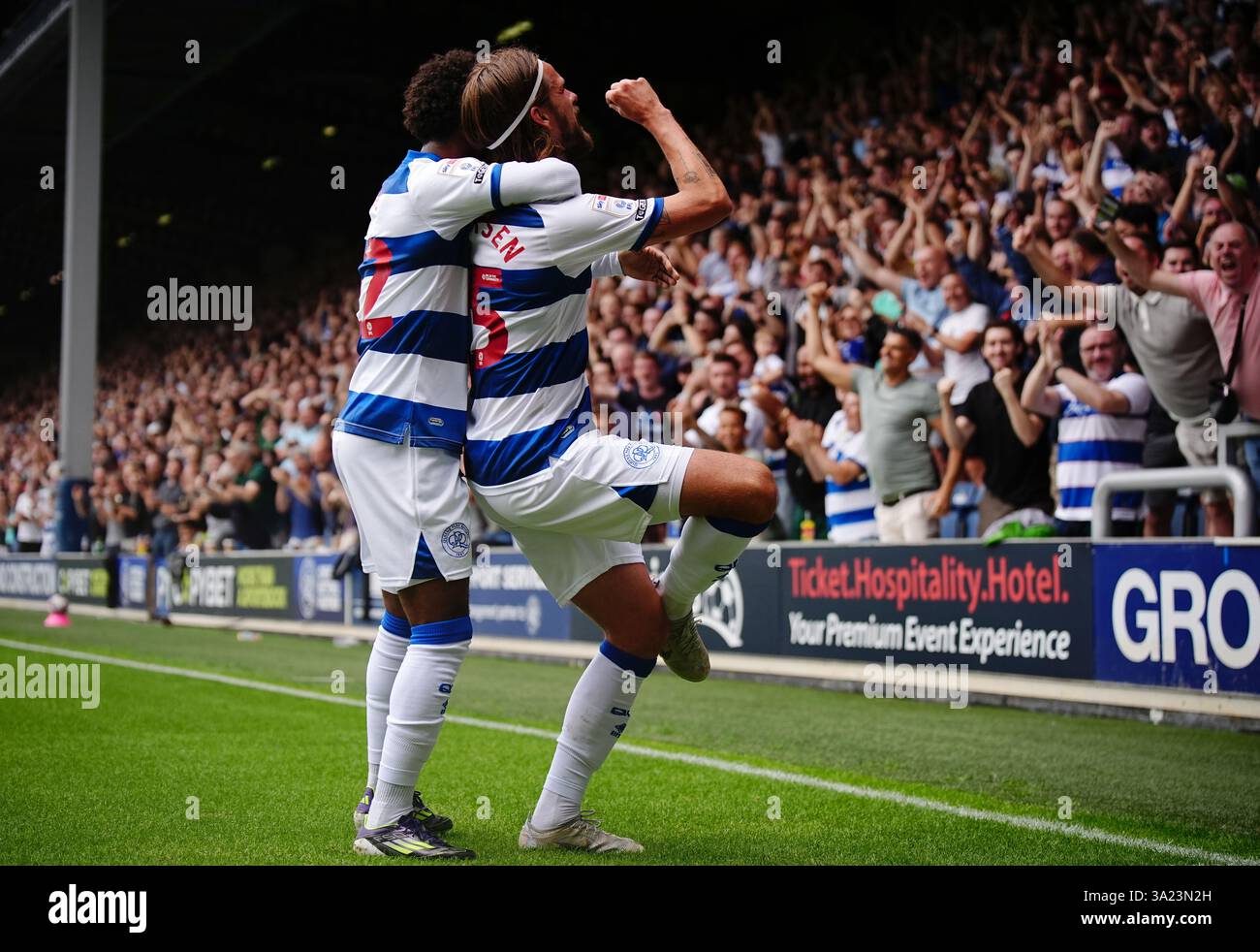 Queens Park Rangers' Lucas Andersen (right) is congratulated by Kenneth ...